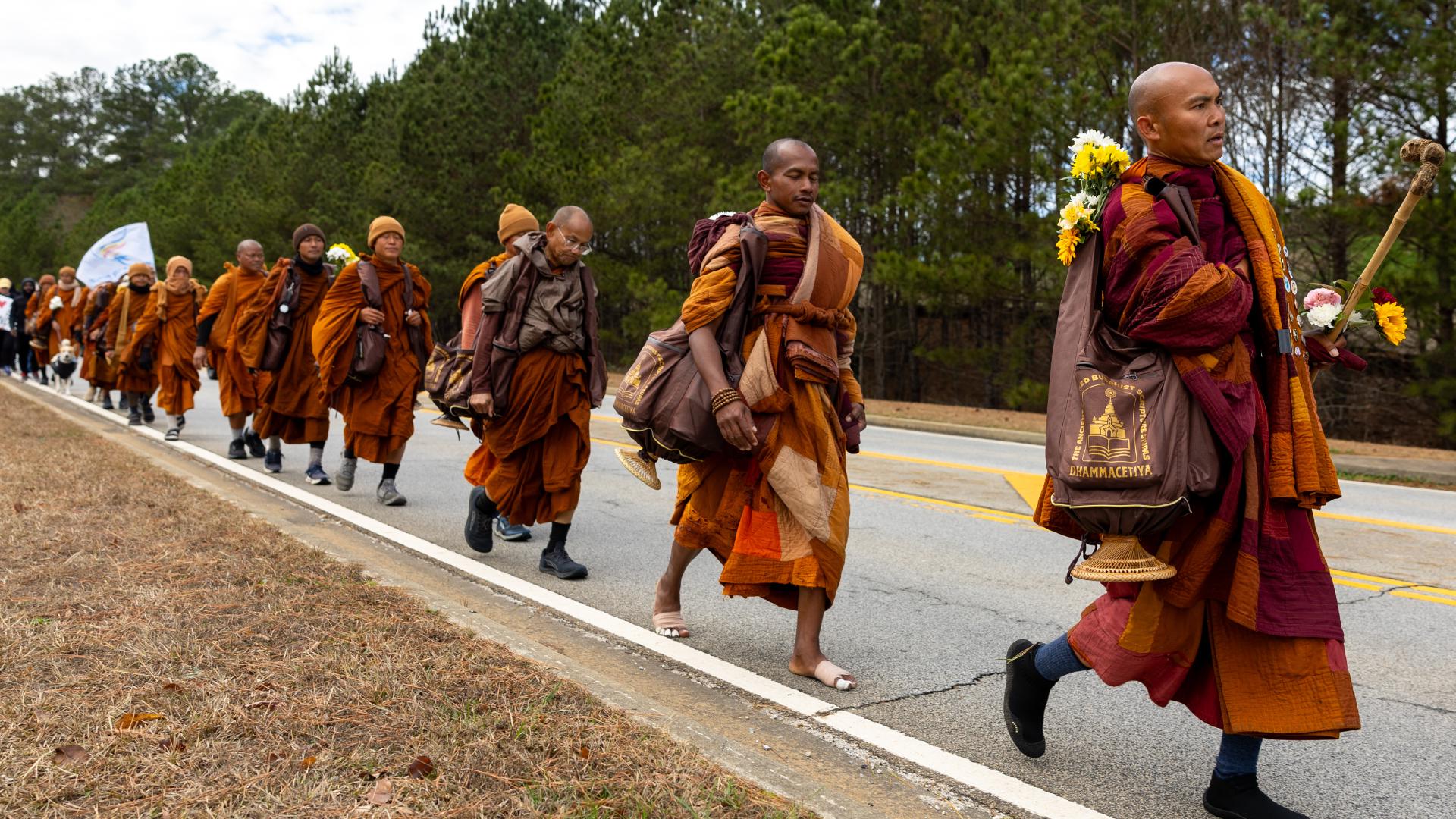 Buddhist monks persist in peace walk from Texas to DC as thousands ...