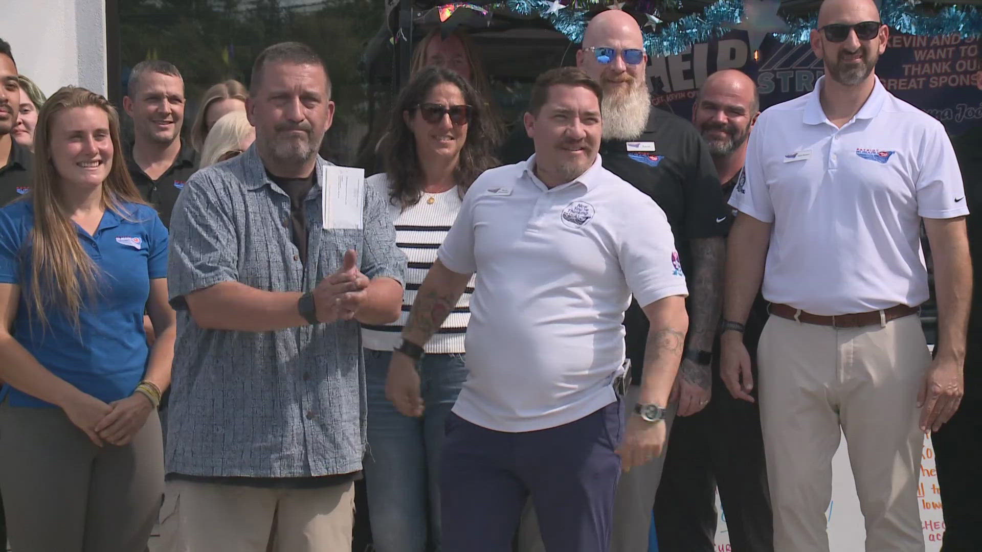 Kevin off the roof of Patriot Subaru in Saco after fundraising goal met ...