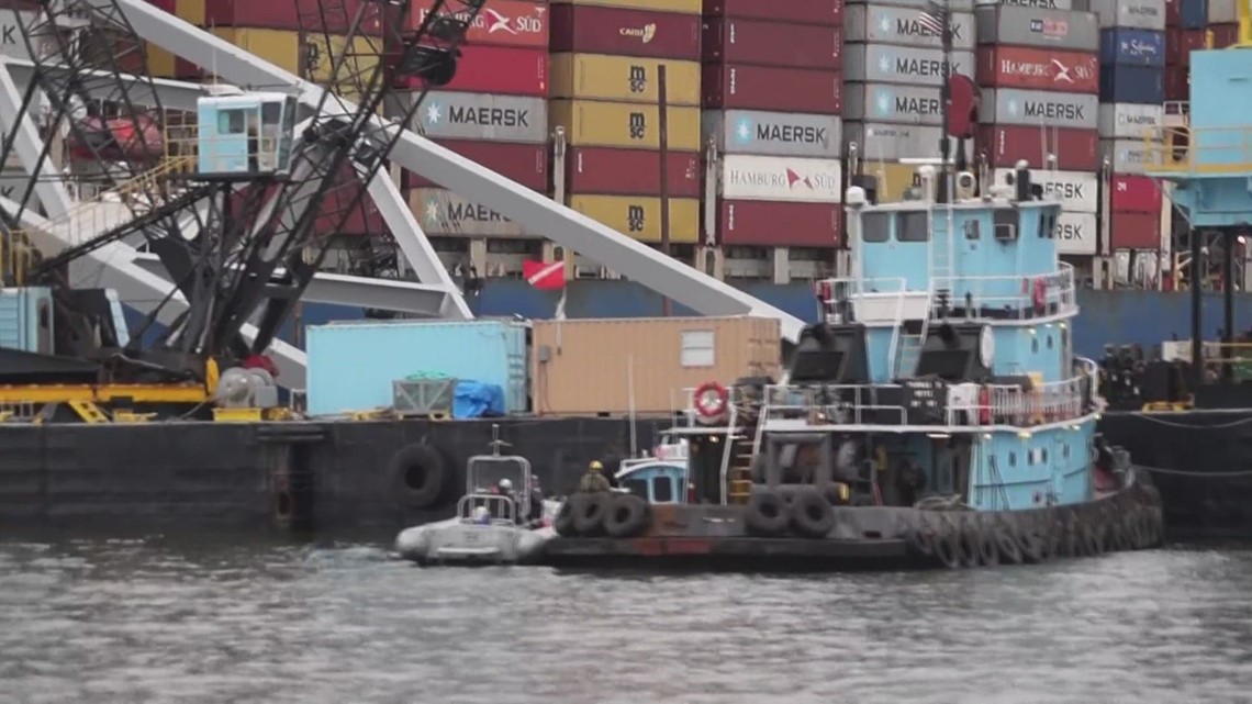 Baltimore bridge: Ships pass through temporary channel while crews ...
