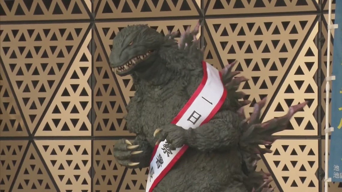 Godzilla stomps through Tokyo streets teaching traffic safety ...