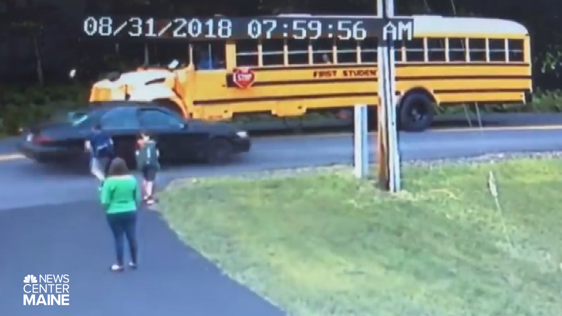 Video shows 2nd grader nearly hit by car as he gets on school bus ...