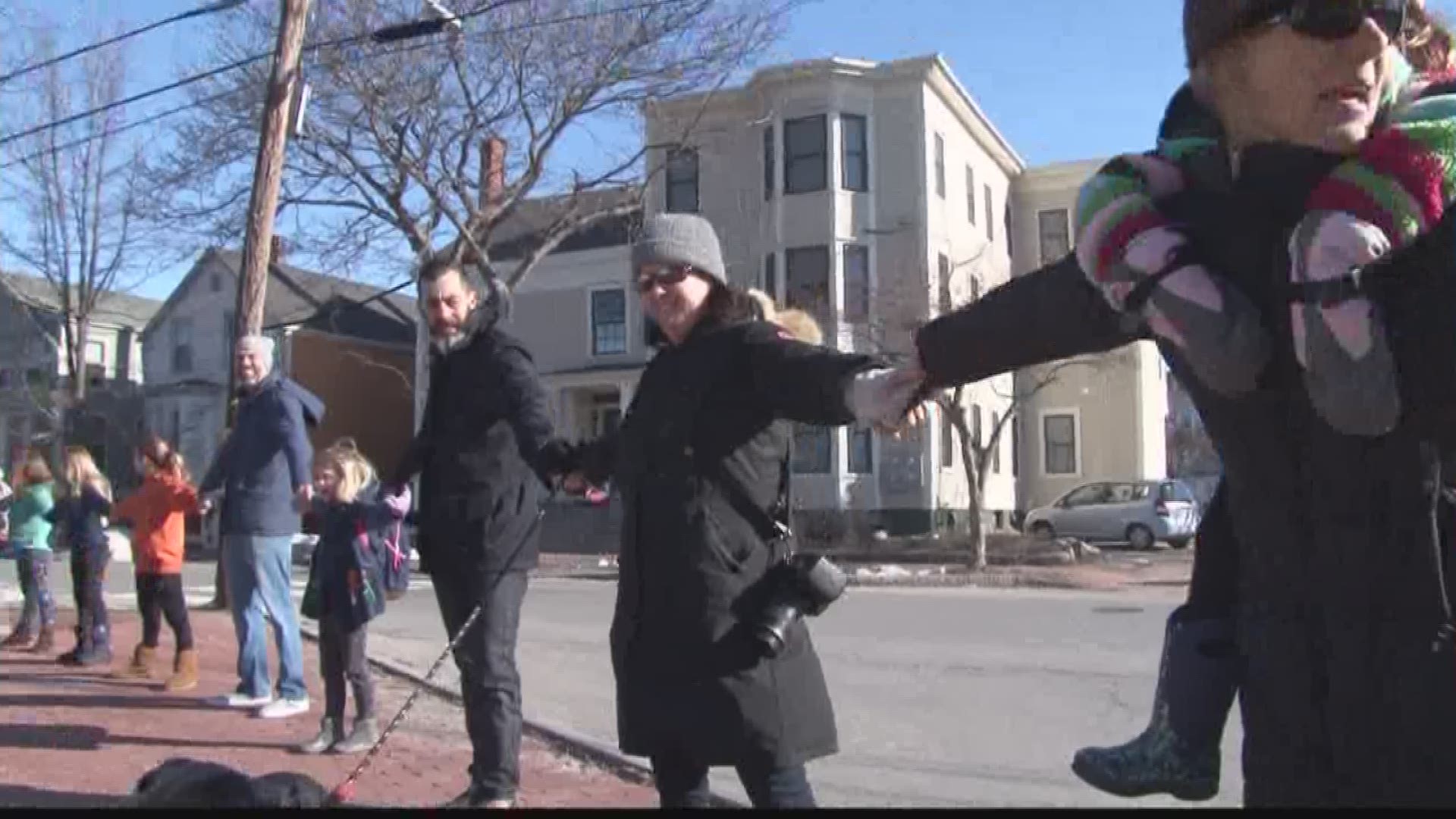 Parents, teachers hold hands around Reiche School | newscentermaine.com