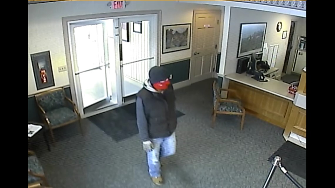 Armed bank robber jumps up on the counter and demands money ...